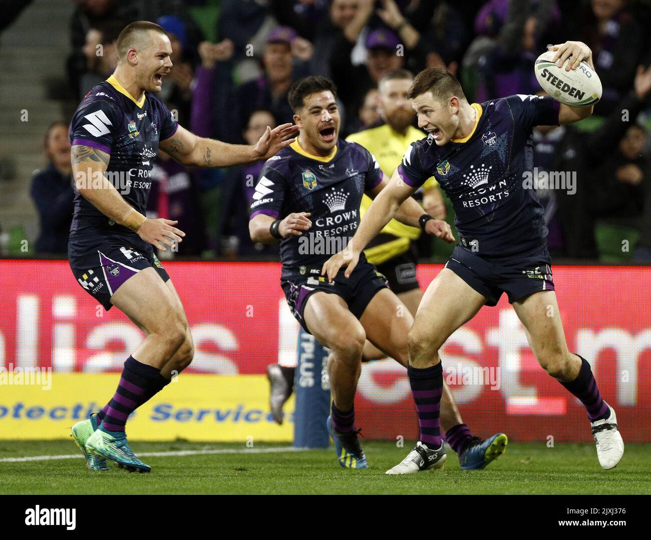 Ryley Jacks of the Storm (right) celebrates as try during the Round 17 ...