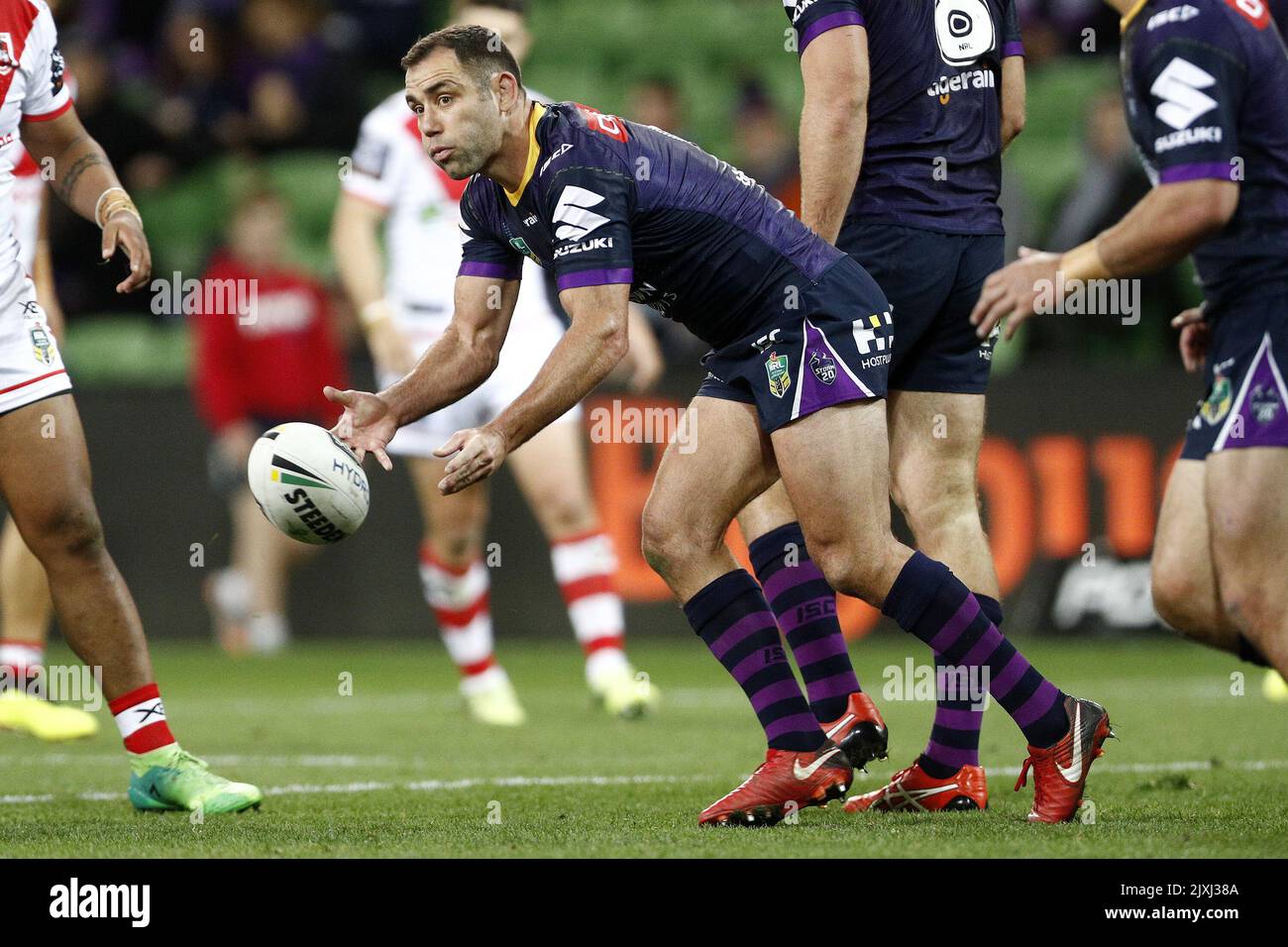Cameron Smith of the Storm passes the ball during the Round 17 NRL ...