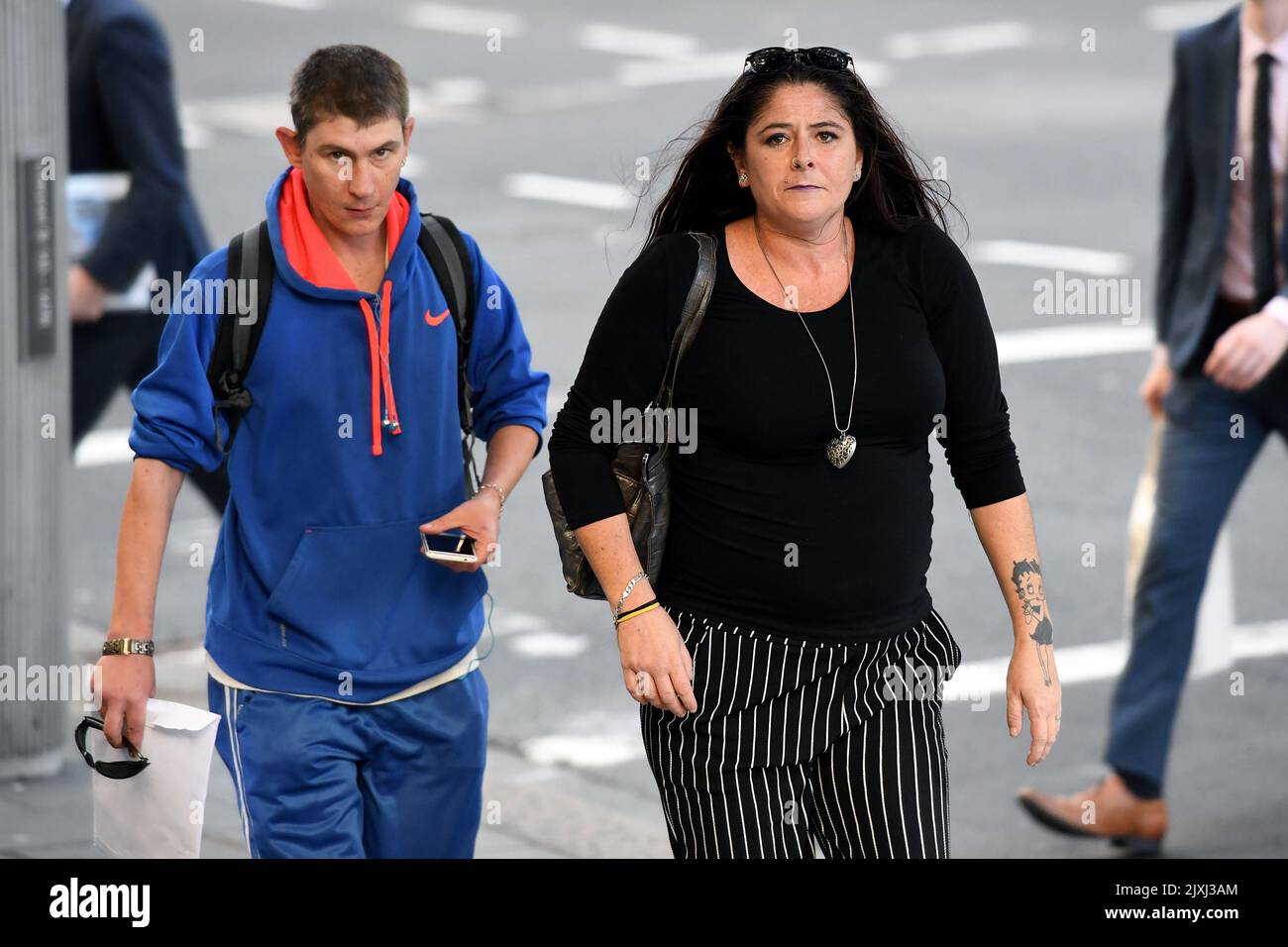 Alison Christie Mains (right) arrives at the Downing Centre court ...