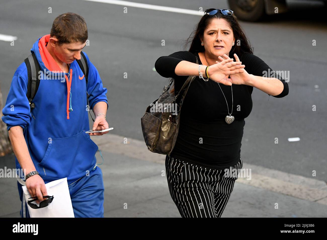 Alison Christie Mains (right) arrives at the Downing Centre court ...
