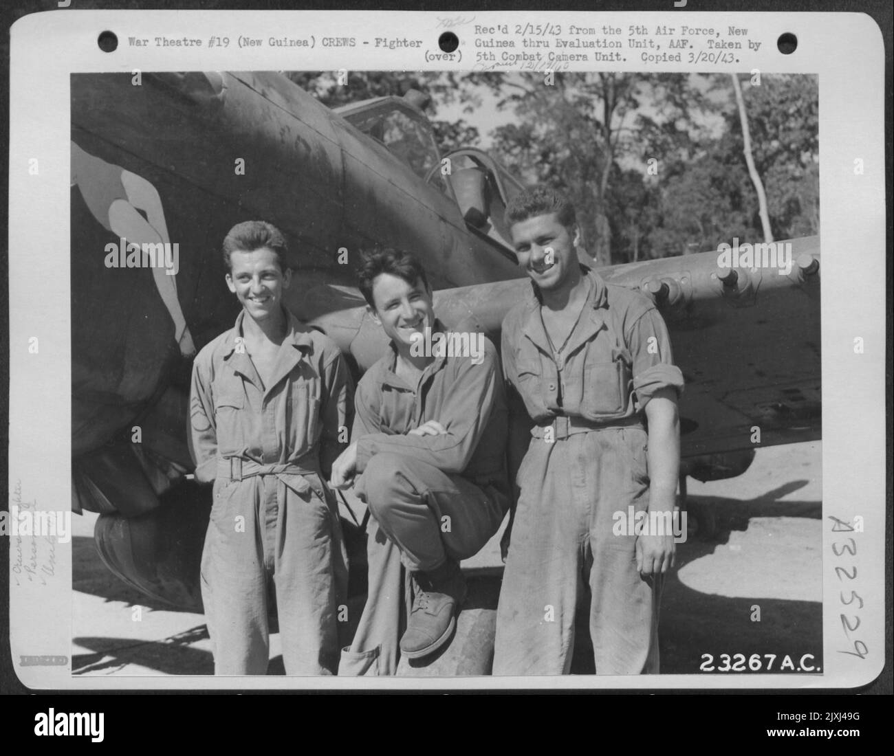 Pilot Lucius D. LaCroix and crew of the 49th Fighter Group pose beside ...