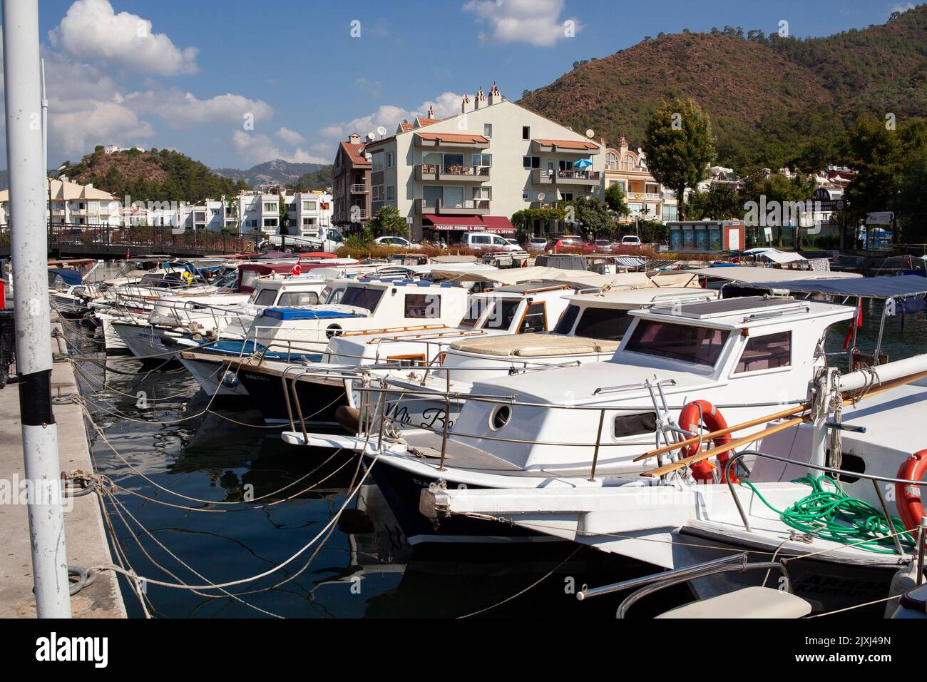 Harbor and port in resort city Marmaris with moored boats and ships ...