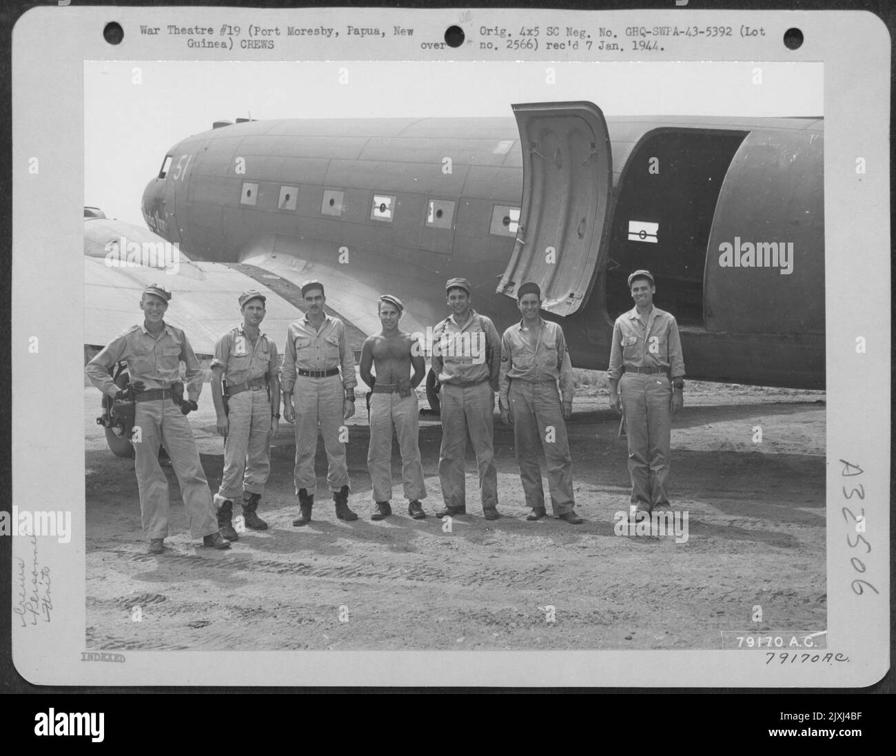 C-47 transport plane and crew from the 6th Troop Carrier Sq. 5th Air ...