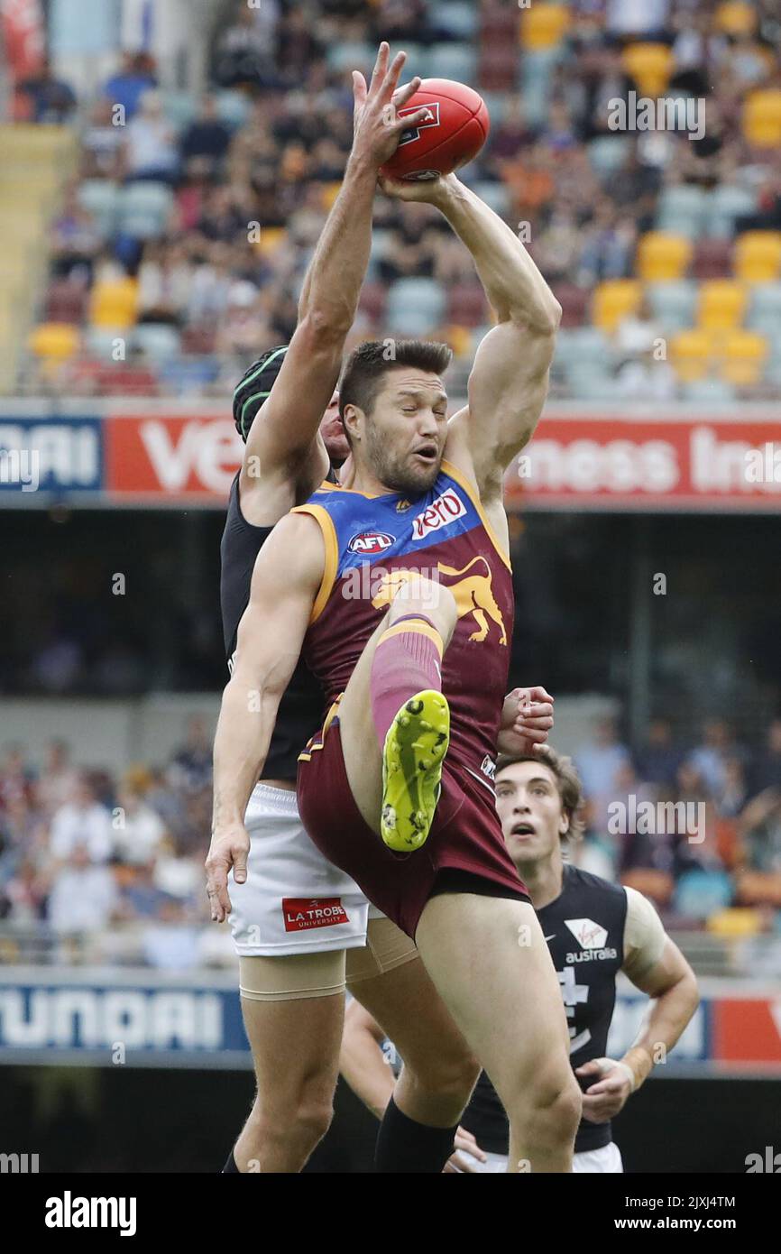 Stefan Martin of the Lions knocks the ball away during the Round 16 AFL ...