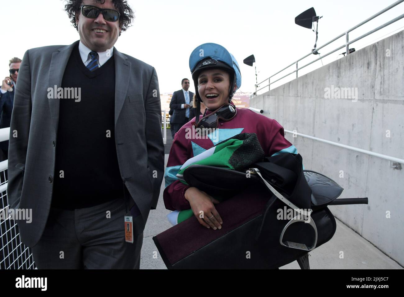 Jockey Rachel Hunt is seen walking to the jockey's room after race 8 ...