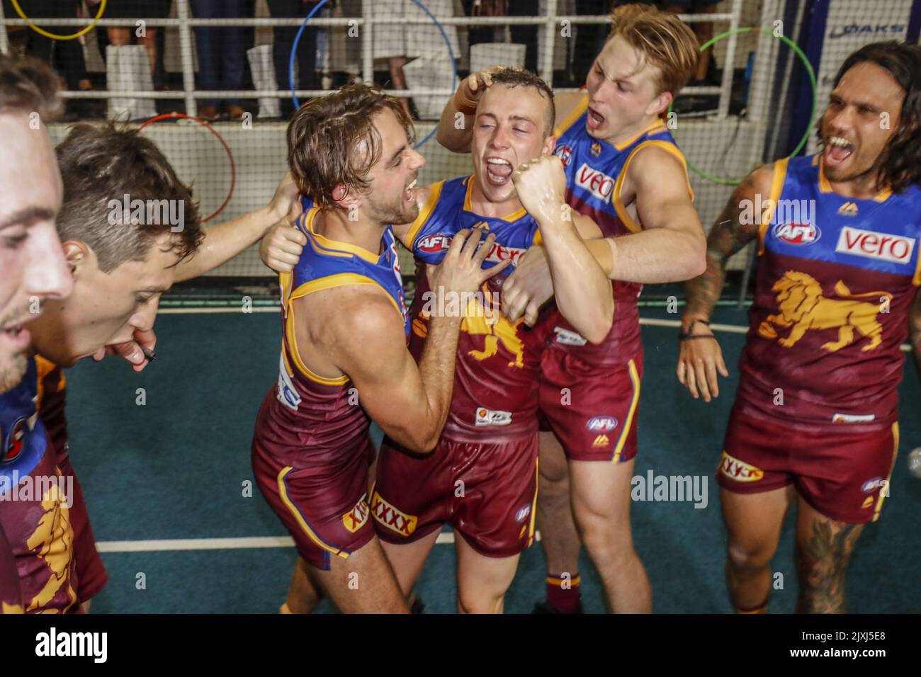 Lewis Taylor of the Lions (centre) celebrates his team's win and his ...