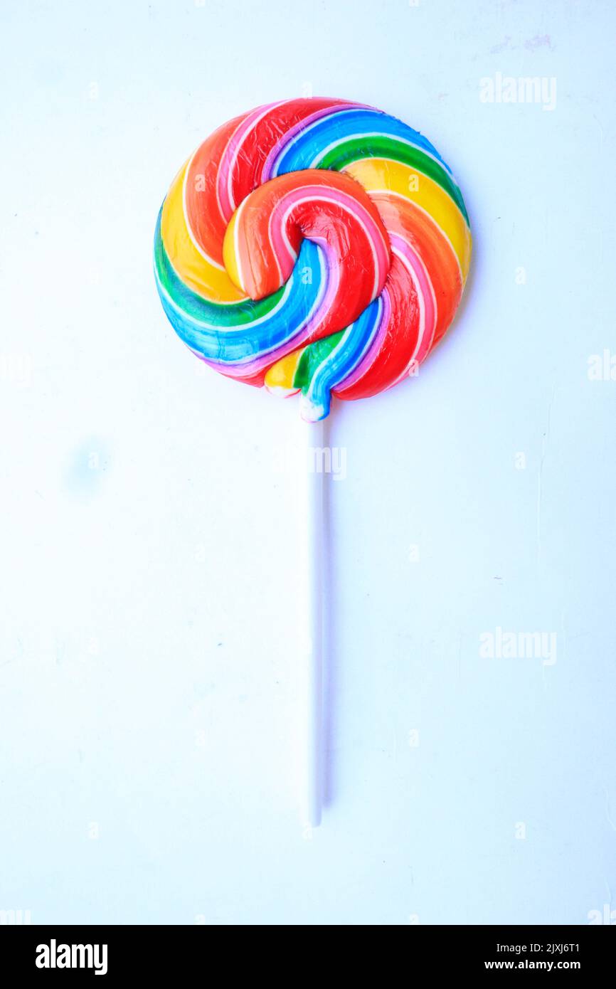 lollipop, Colorful rainbow lollipop swirl on plastic stick isolated on ...