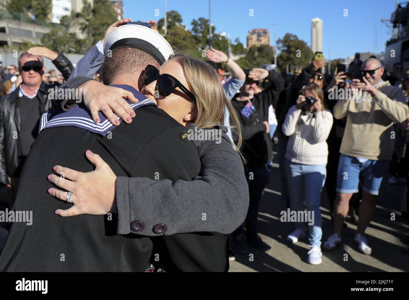 Family and friends greet loved ones as they disembark HMAS Warramunga ...