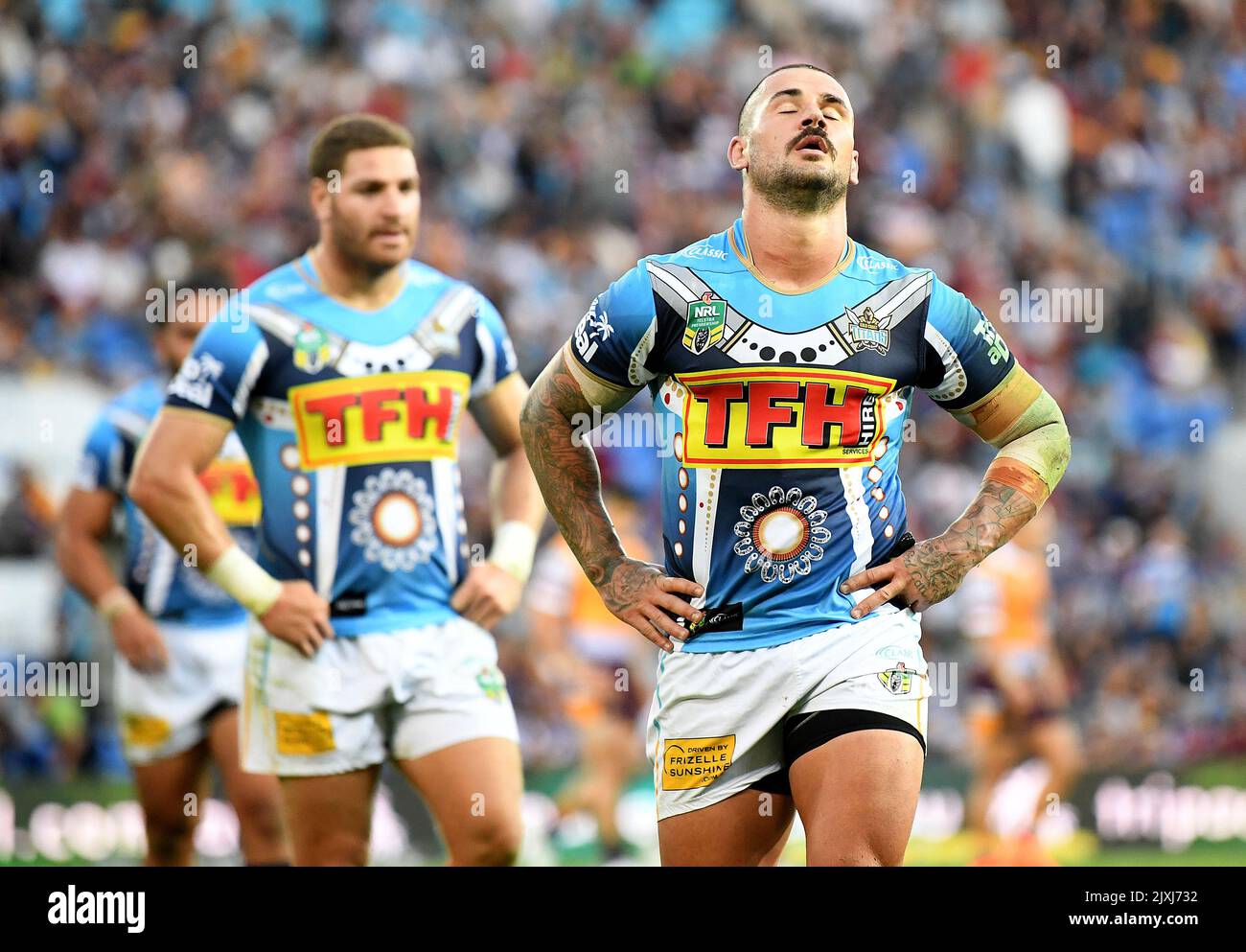 Nathan Peats of the Titans (right) reacts during the Round 17 NRL match ...