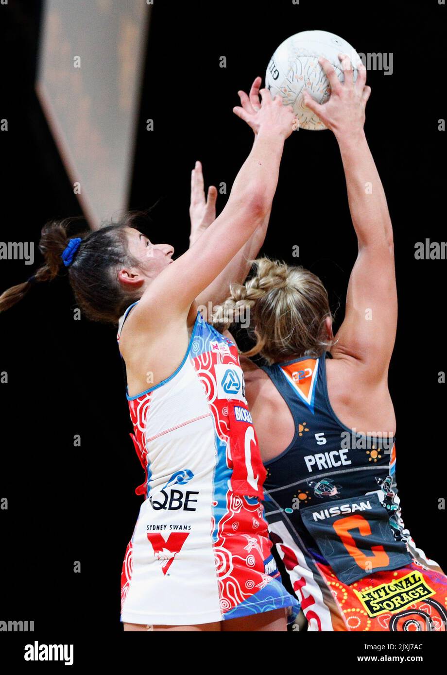 Jamie-Lee Price of the Giants (right) and Maddy Proud of the Swifts ...