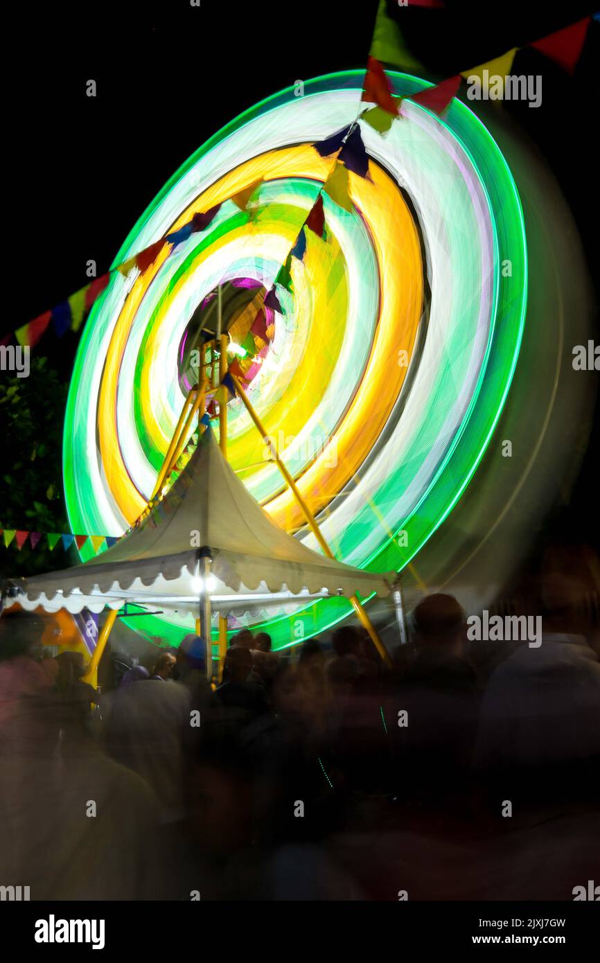 Ferris wheel at night festival in slow motion photo. High Roller Stock ...