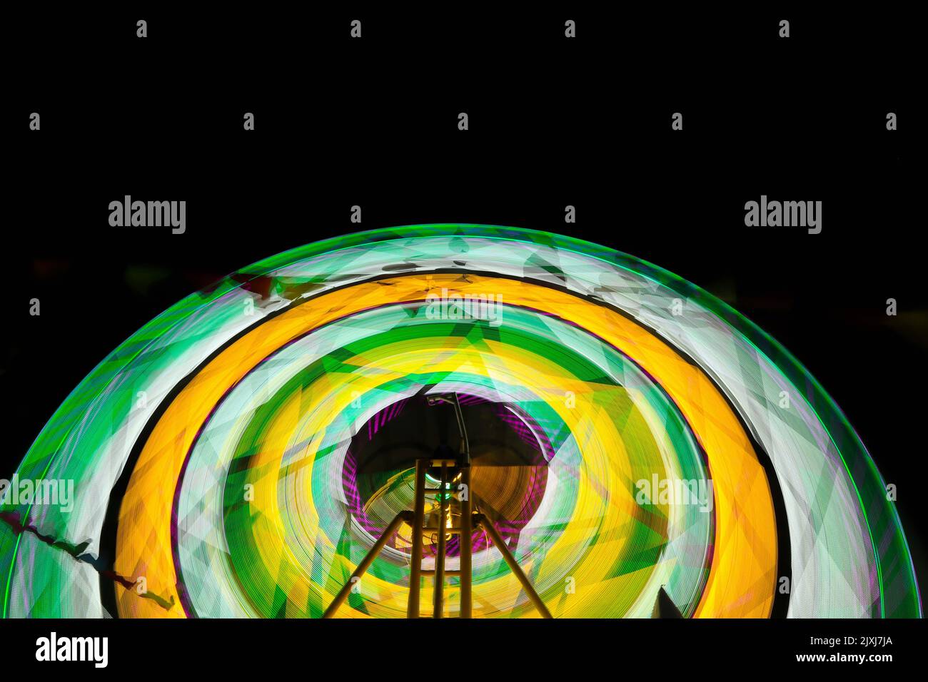 Ferris wheel at night festival in slow motion photo. High Roller Stock ...