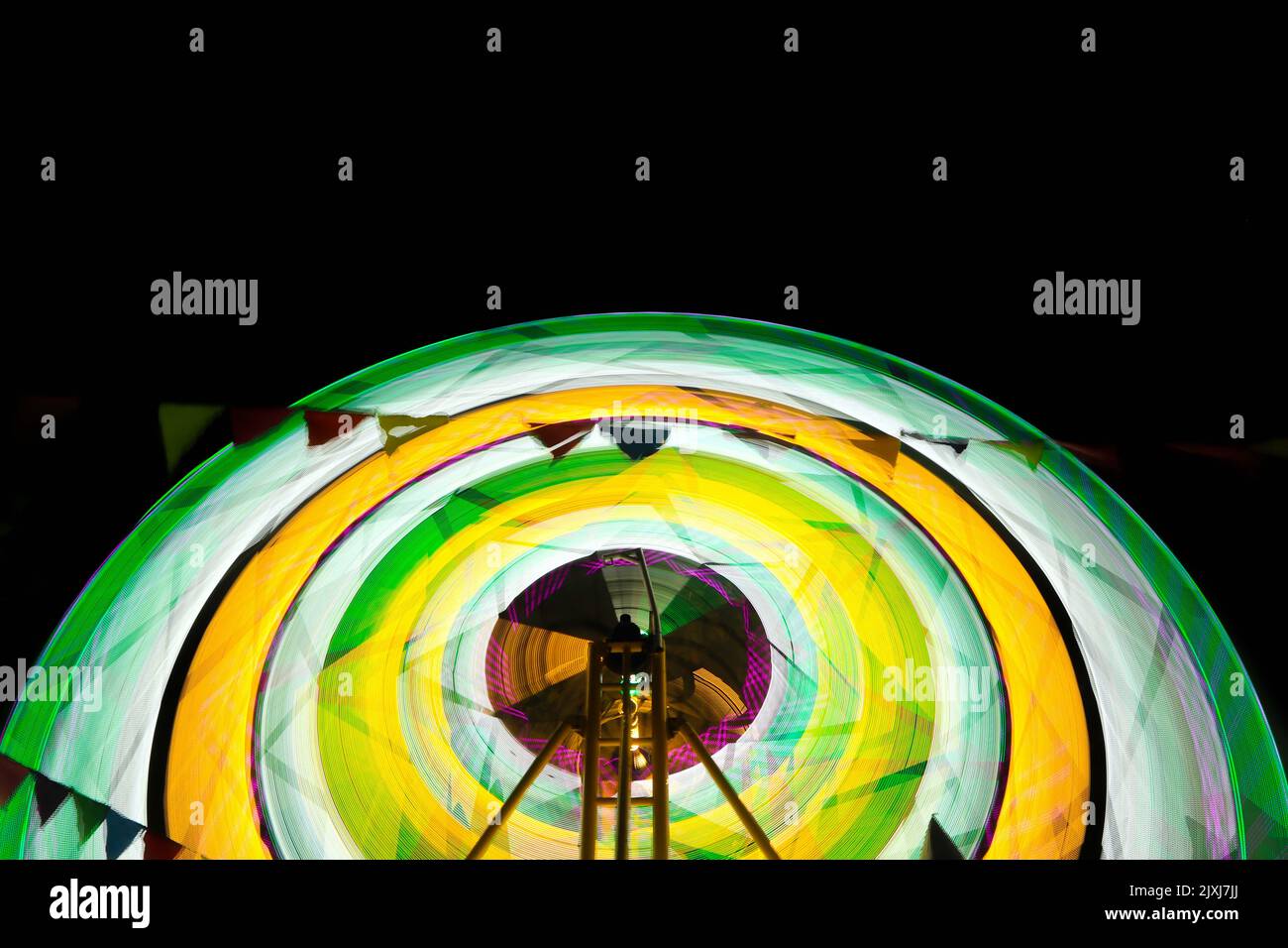 Ferris wheel at night festival in slow motion photo. High Roller Stock ...