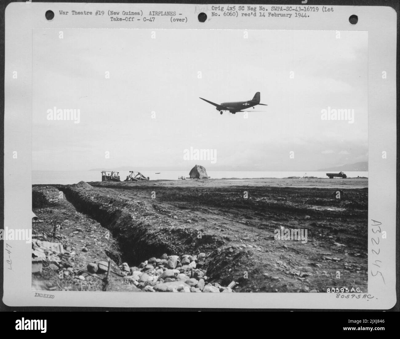 A Douglas C-47 supply plane takes off from an airstrip at Lae, New ...