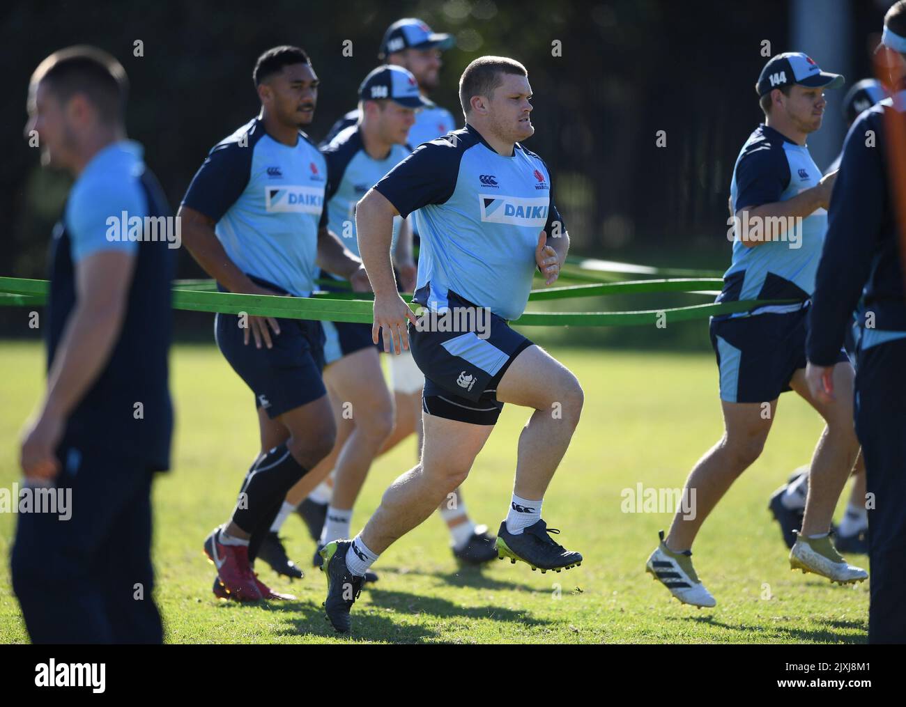 Tom Robertson of the Waratahs with his teammates during a training ...