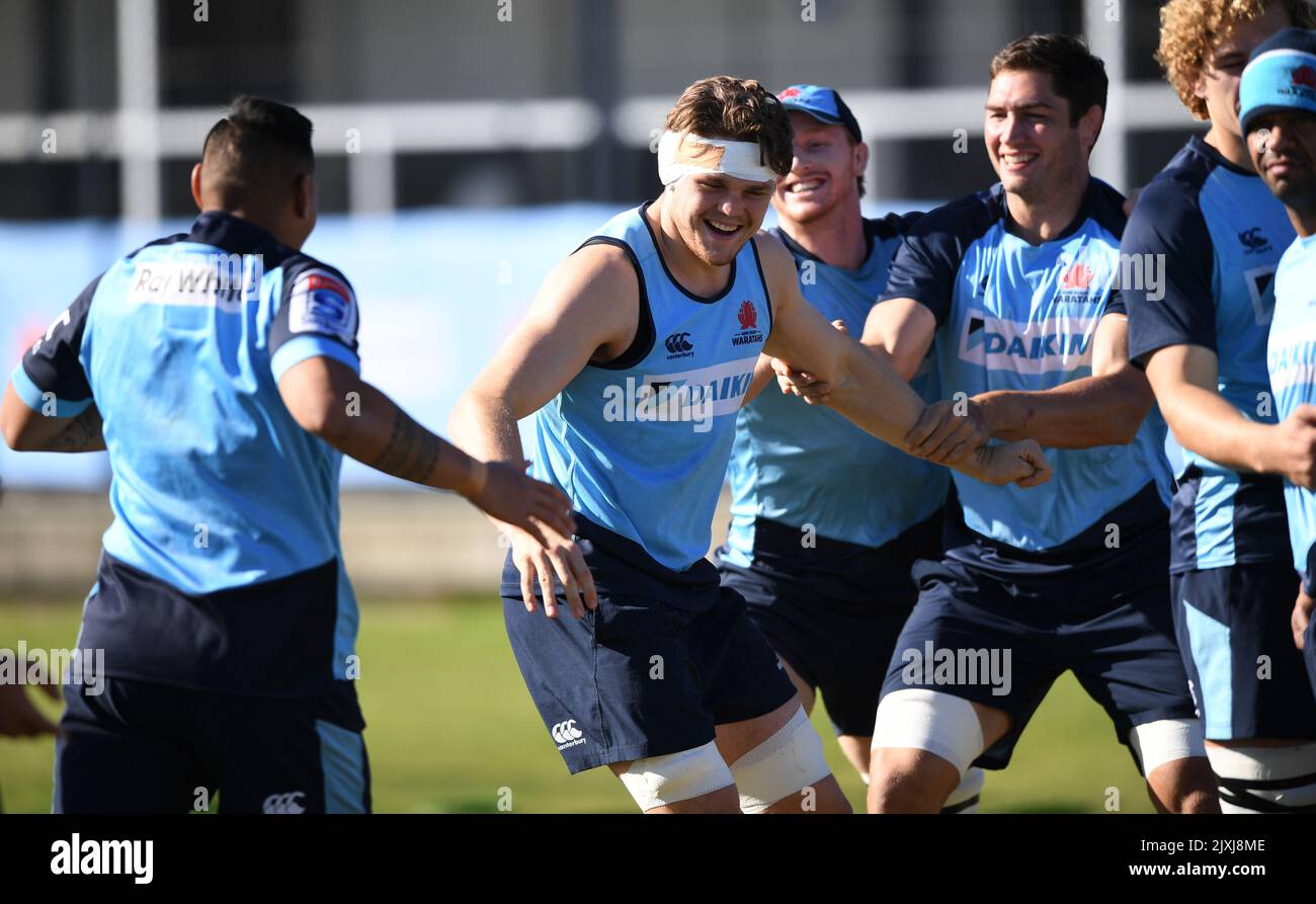Matt Sandell of the Waratahs jokes with his teammates during a training ...