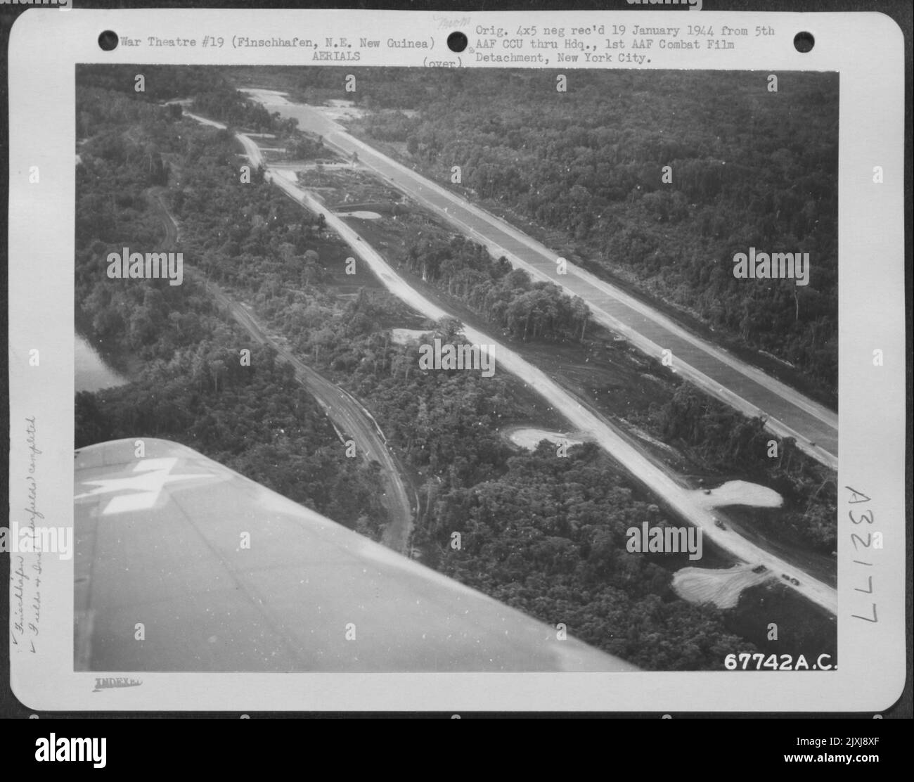 Runway and revetments of an air base of the 5th Army Air Force at ...