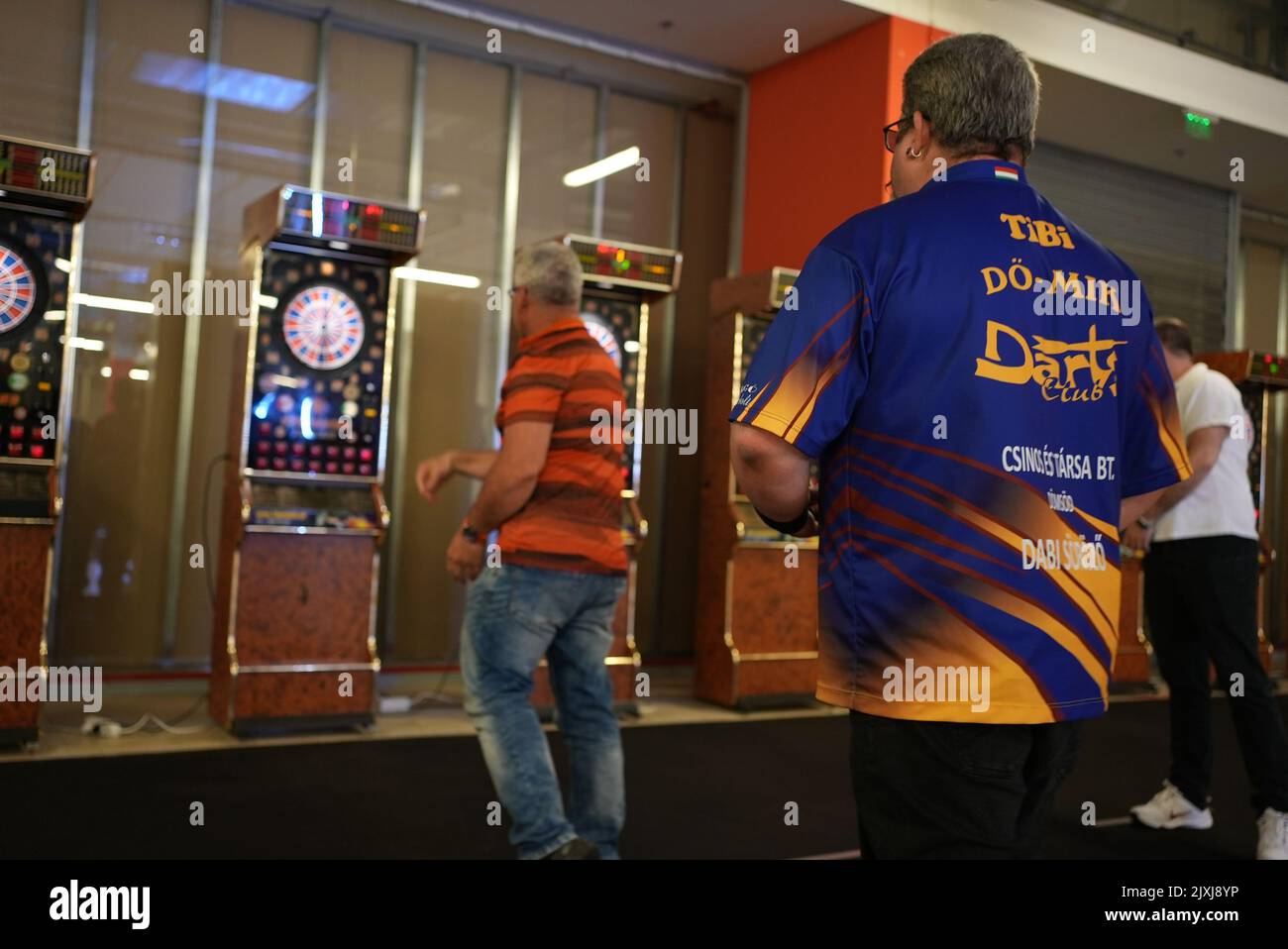 Two senior darts players playing against each other in a pub Stock ...