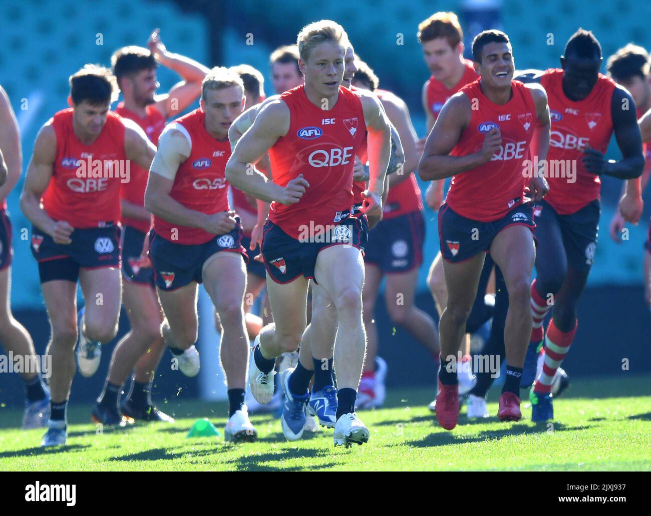Isaac Heaney of the Sydney Swans (centre) runs during a team training ...