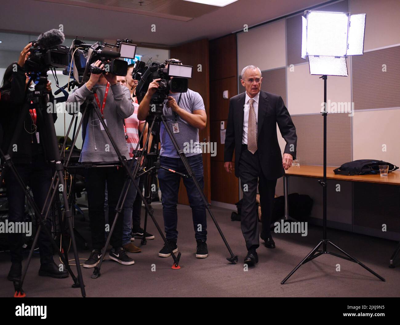 ACCC Chairman Rod Sims (right) arrives to a media conference at the ...