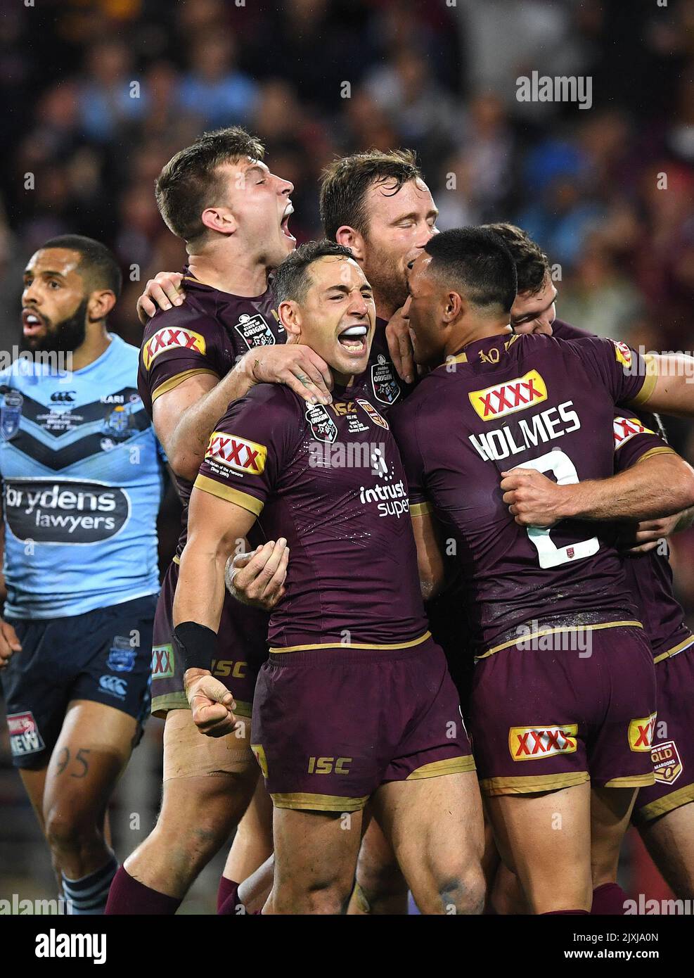Billy Slater of the Maroons (centre) reacts after Daly Cherry-Evans ...