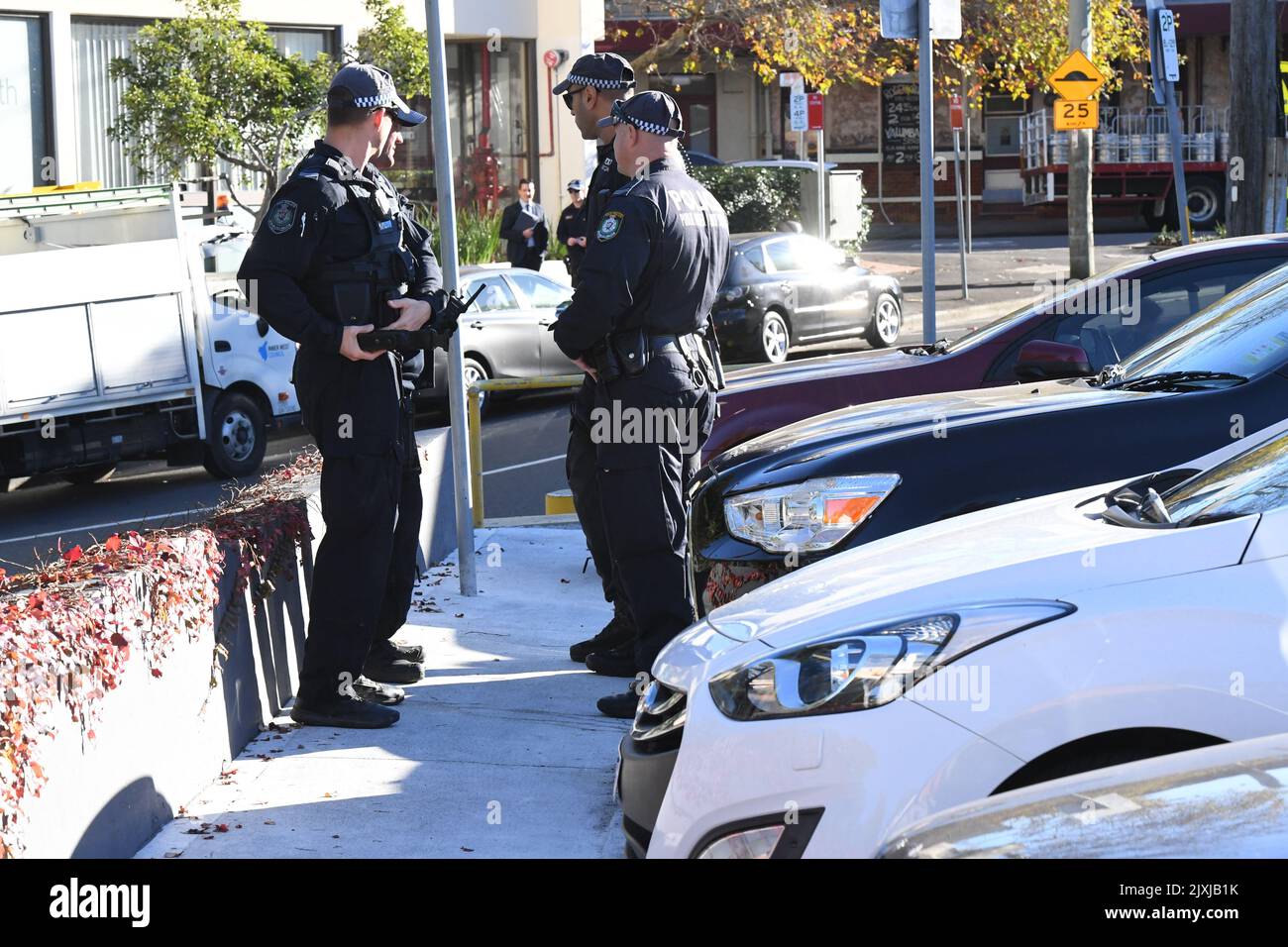 Police are seen working at the Balmain Woolworths car park where a 16 ...