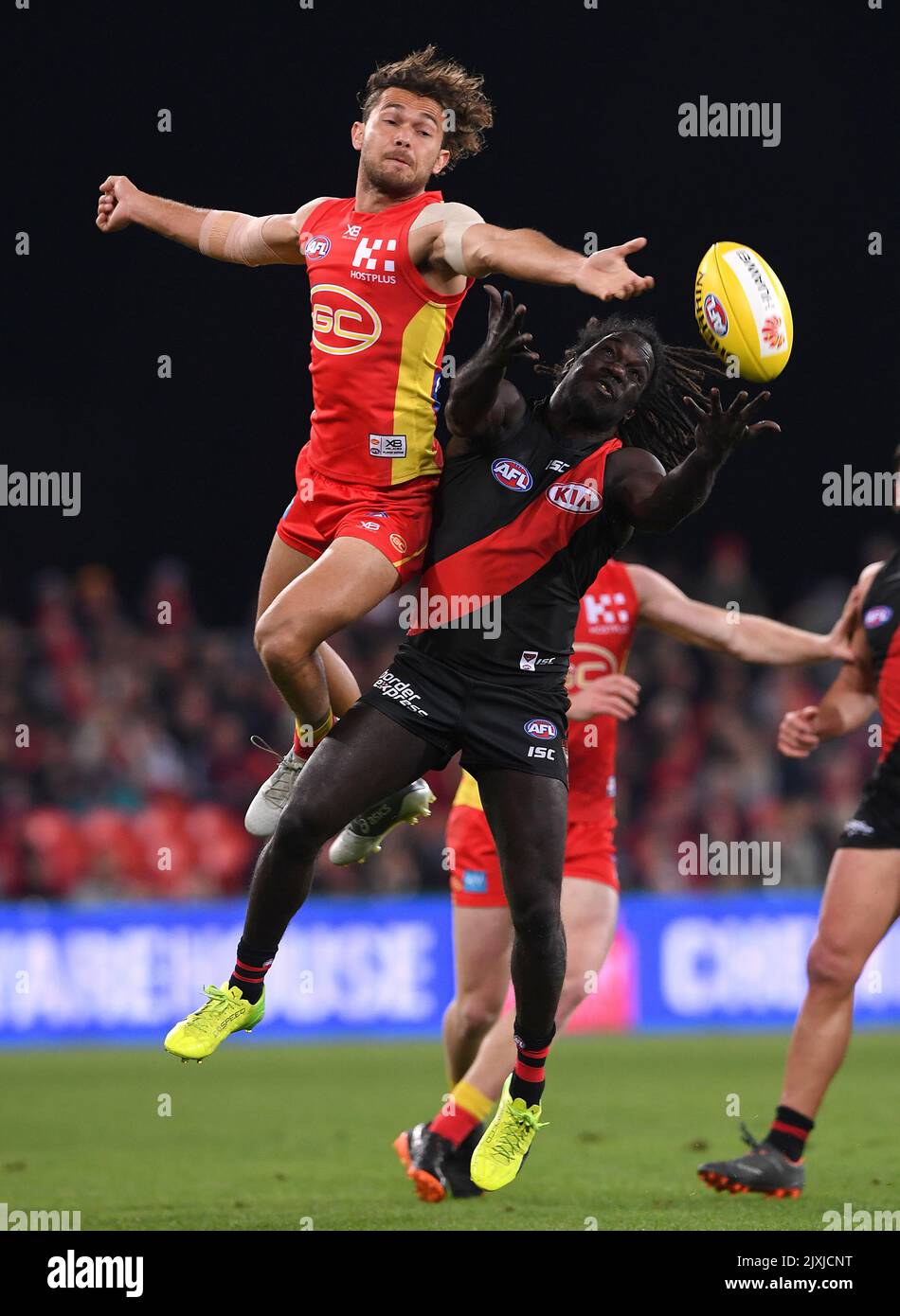 Jarrod Harbrow of the Suns (left) competes with Anthony McDonald ...