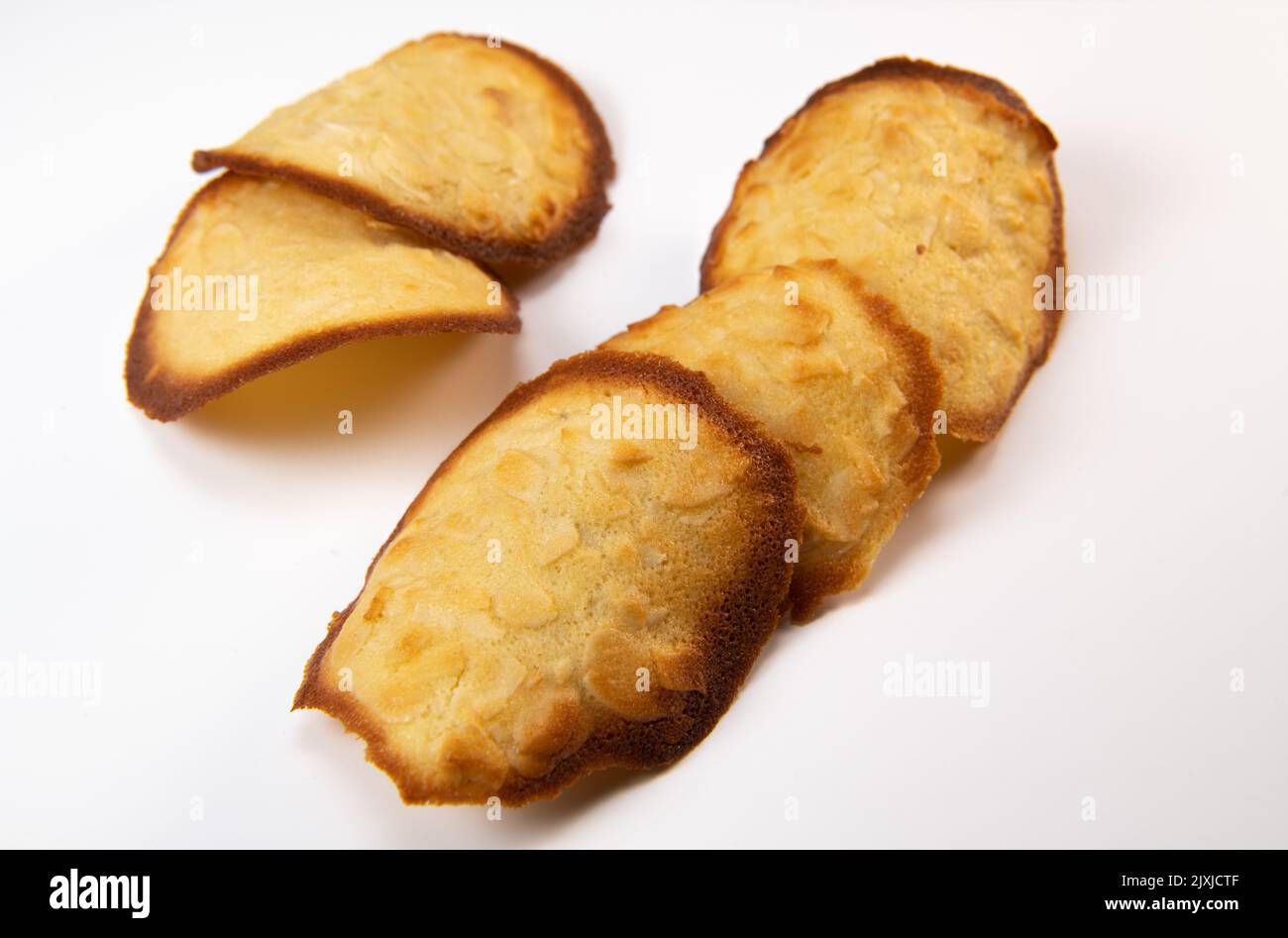 French delicacy pastry tuile with almond on white background Stock ...