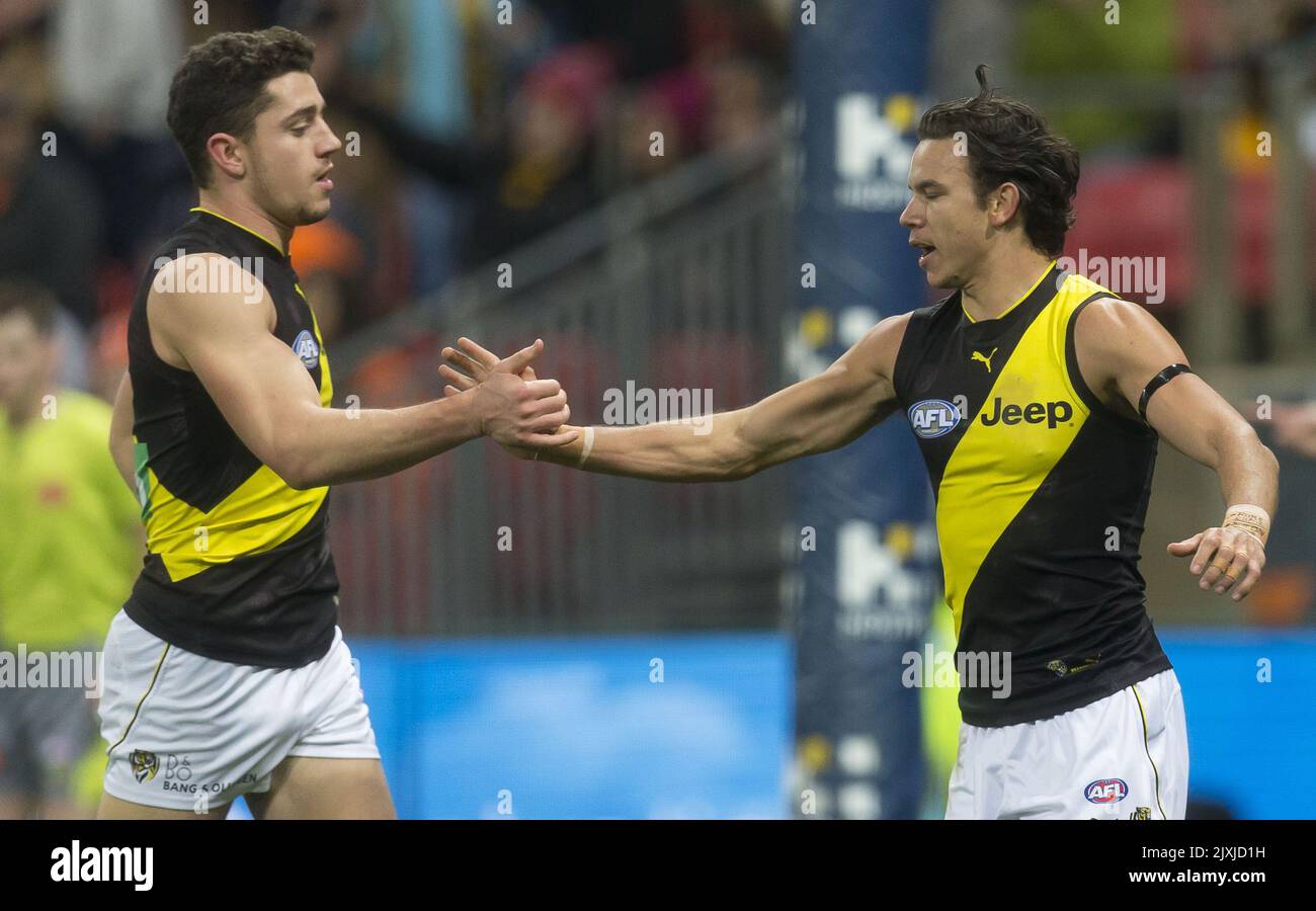 Daniel Rioli of the Tigers celebrates after kicking a goal during the ...