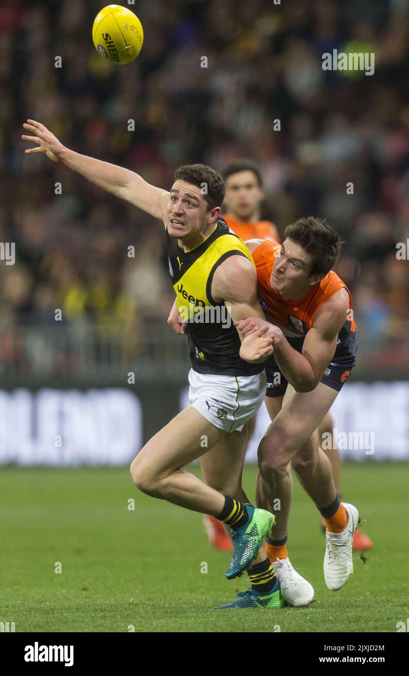 Sam Taylor of the Giants tackles Jason Castagna of the Tigers during ...