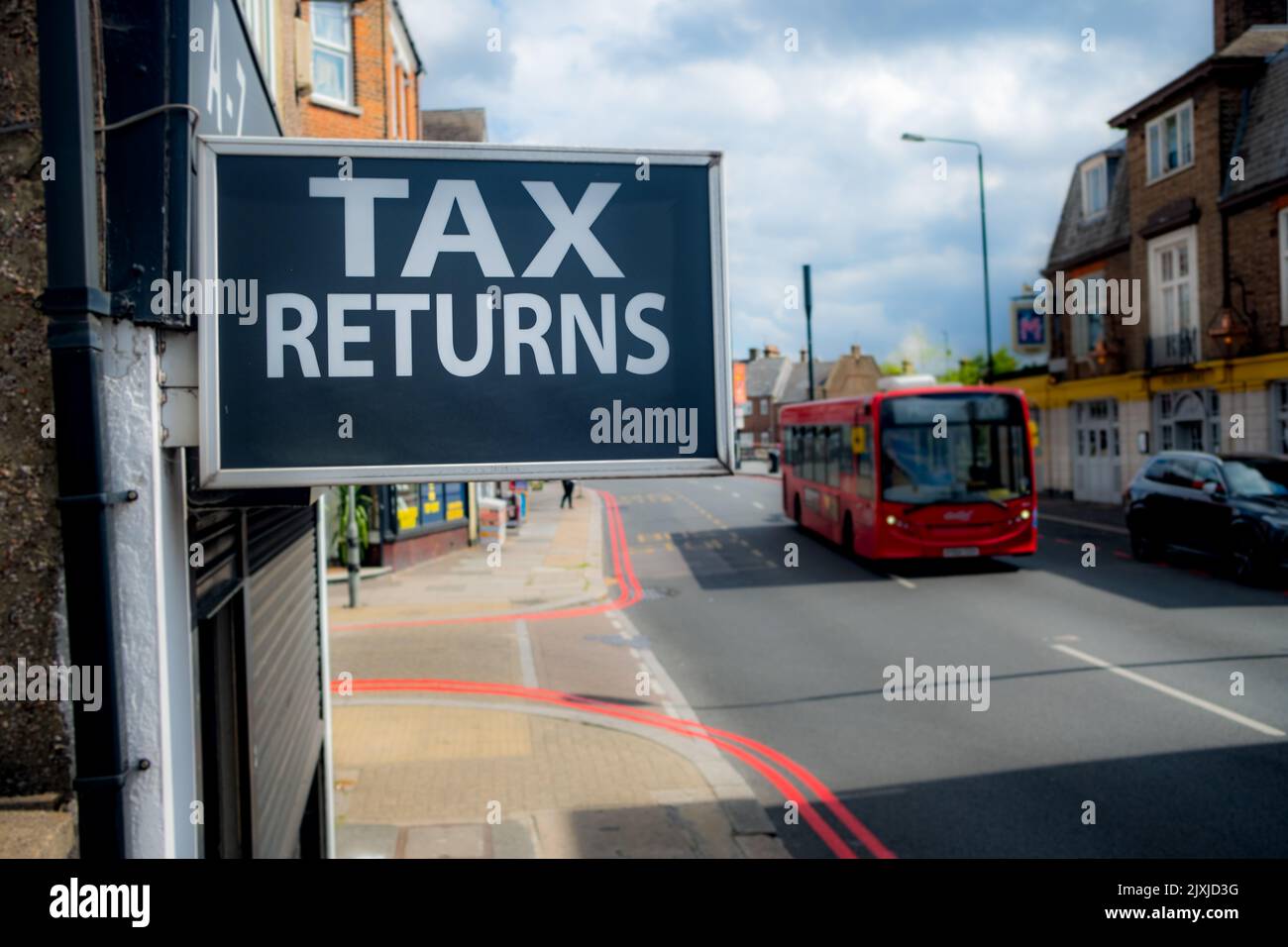 Tax Returns sign on British high street Stock Photo - Alamy
