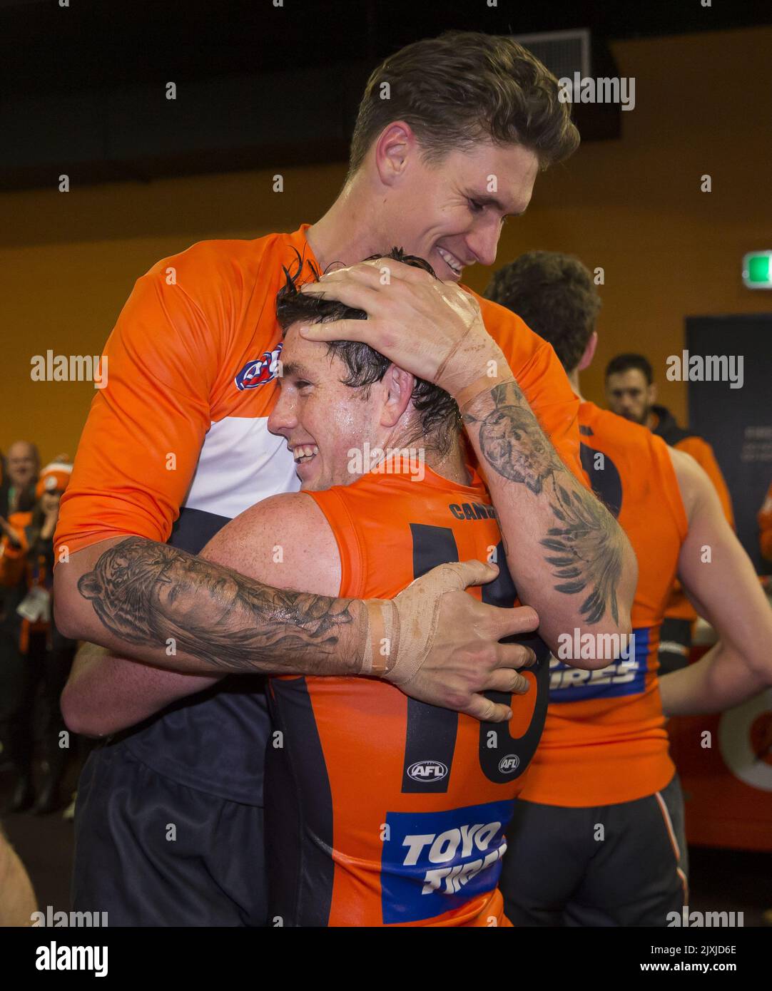Rory Lobb hugs Brent Daniels of the Giants in the rooms after the Round ...