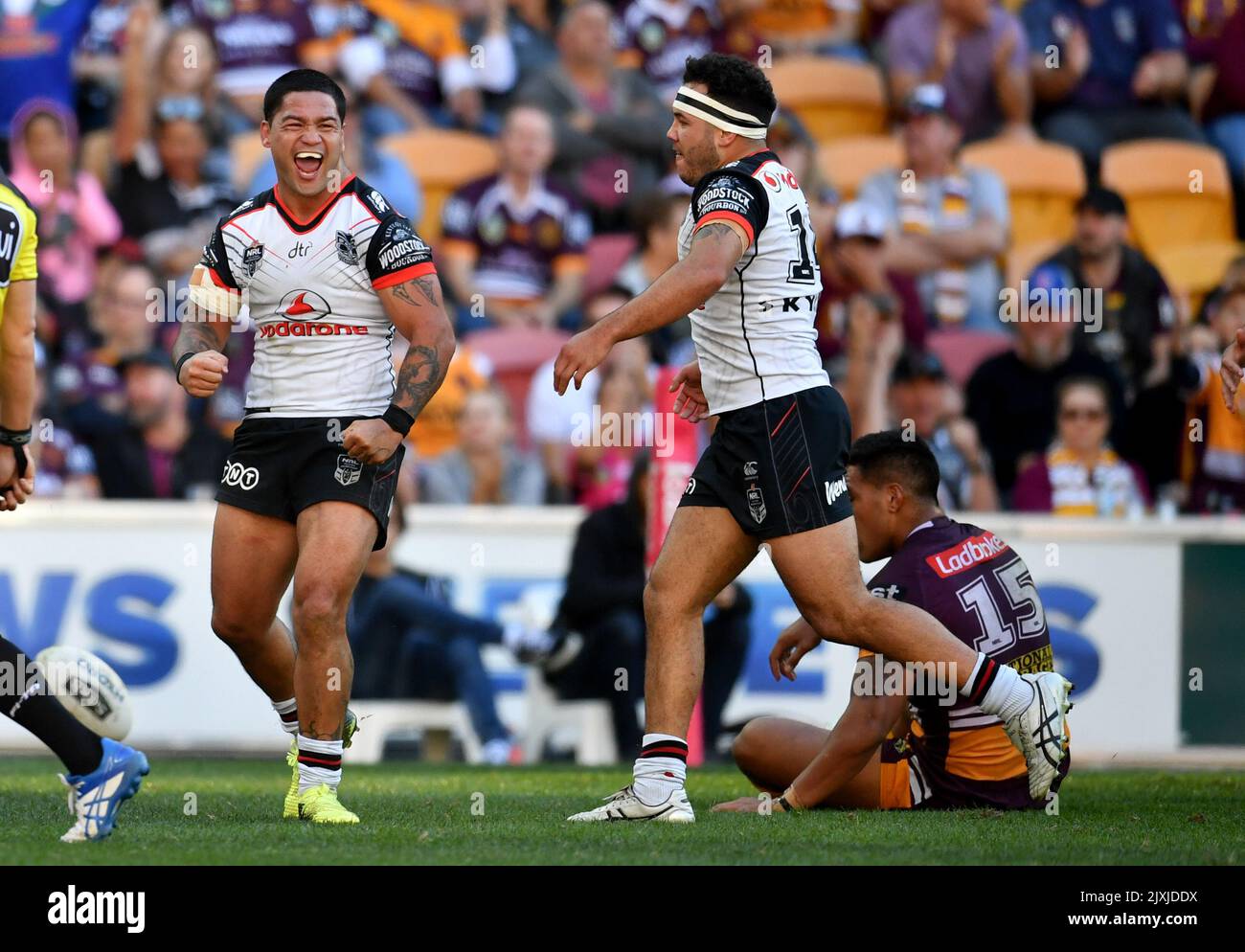 Issac Luke (left) of the Warriors celebrates scoring a try during the ...
