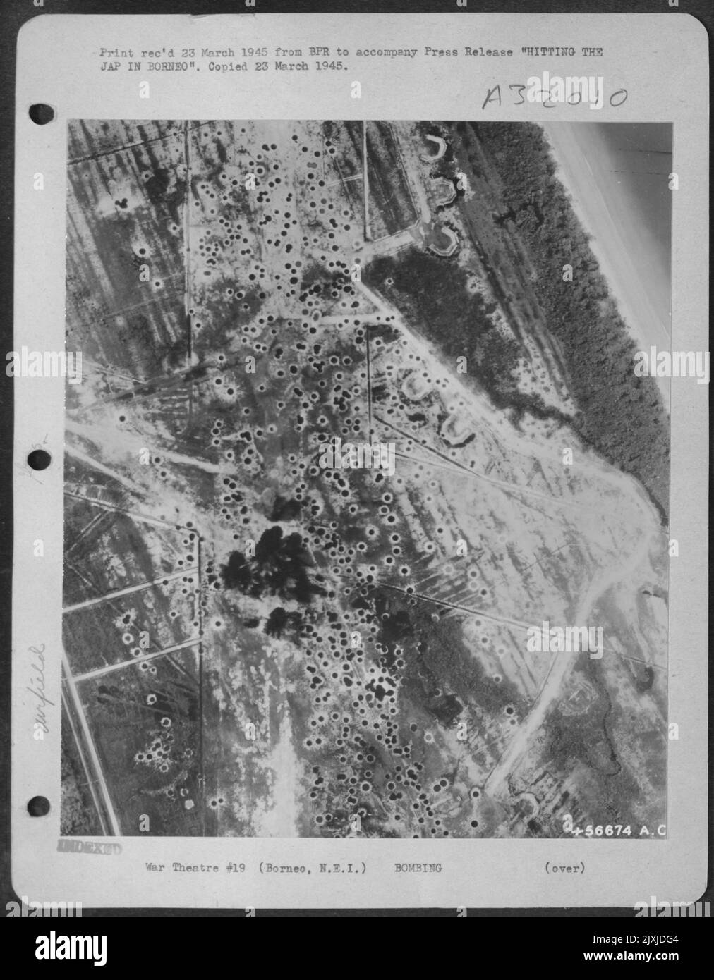 HITTING THE JAP IN BORNEO--This plowed-up patch of ground was one of ...