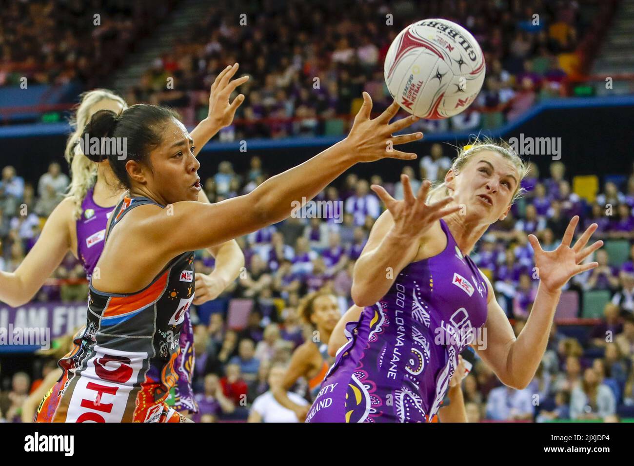 Kristiana Manu'a (left) of the Giants and Gabi Simpson of the Firebirds ...
