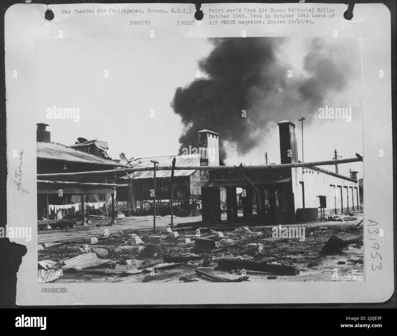 These factories stand gutted by flames, and black clouds of smoke still ...