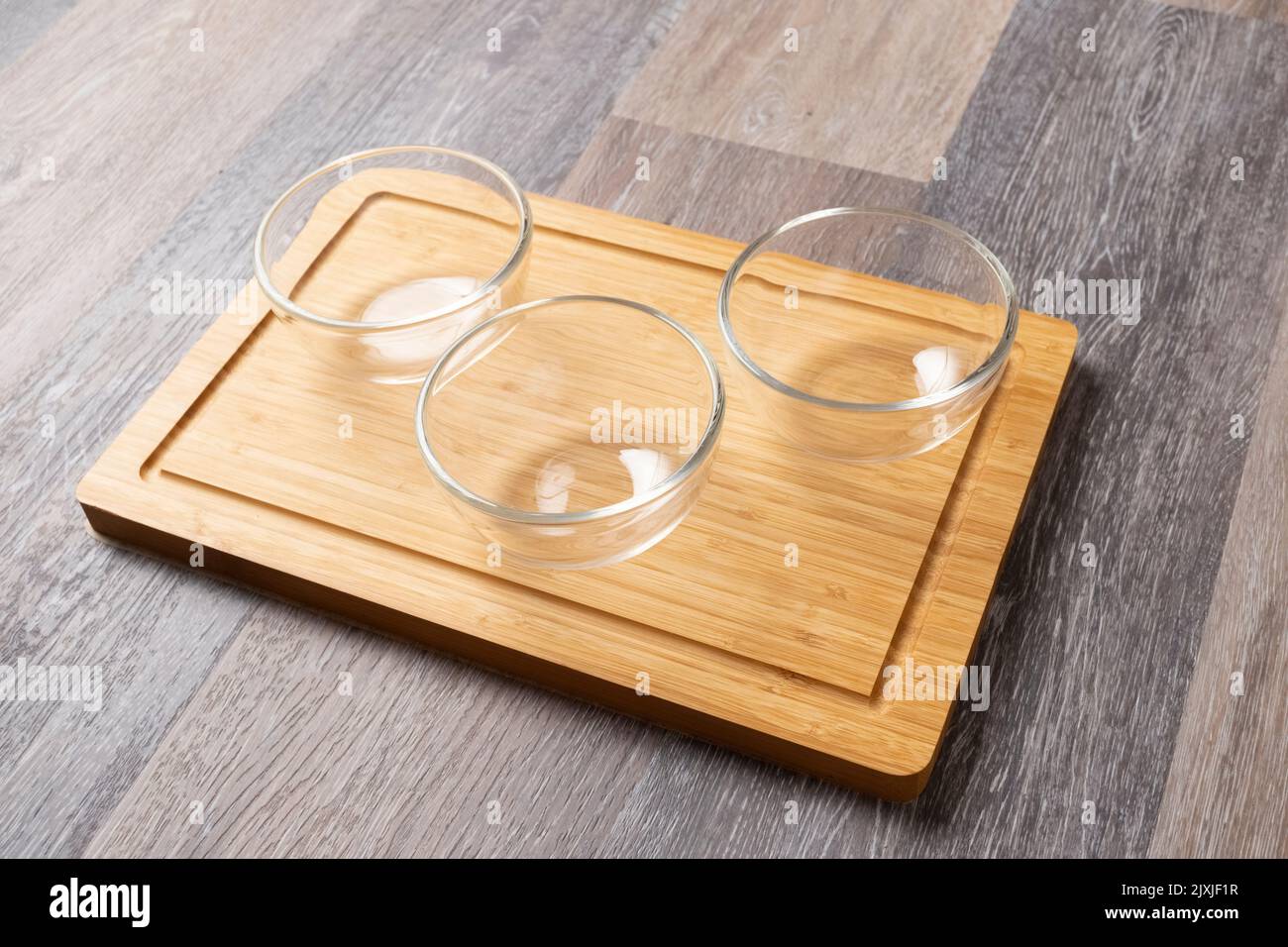 Empty bowls with breakfast ingredients on a wooden table, close-up ...