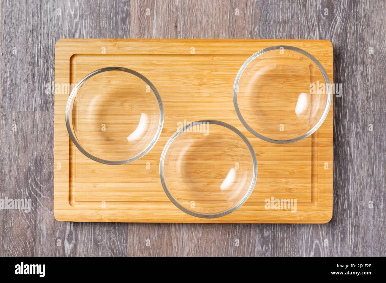 Empty bowls with breakfast ingredients on a wooden table, close-up ...