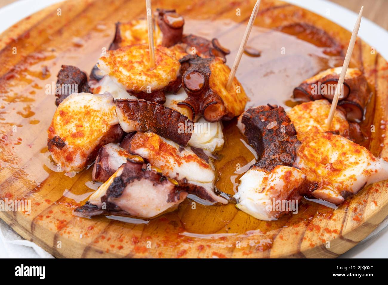 Ration of pulpo a feira, typical Galician recipe for cooking octopus ...