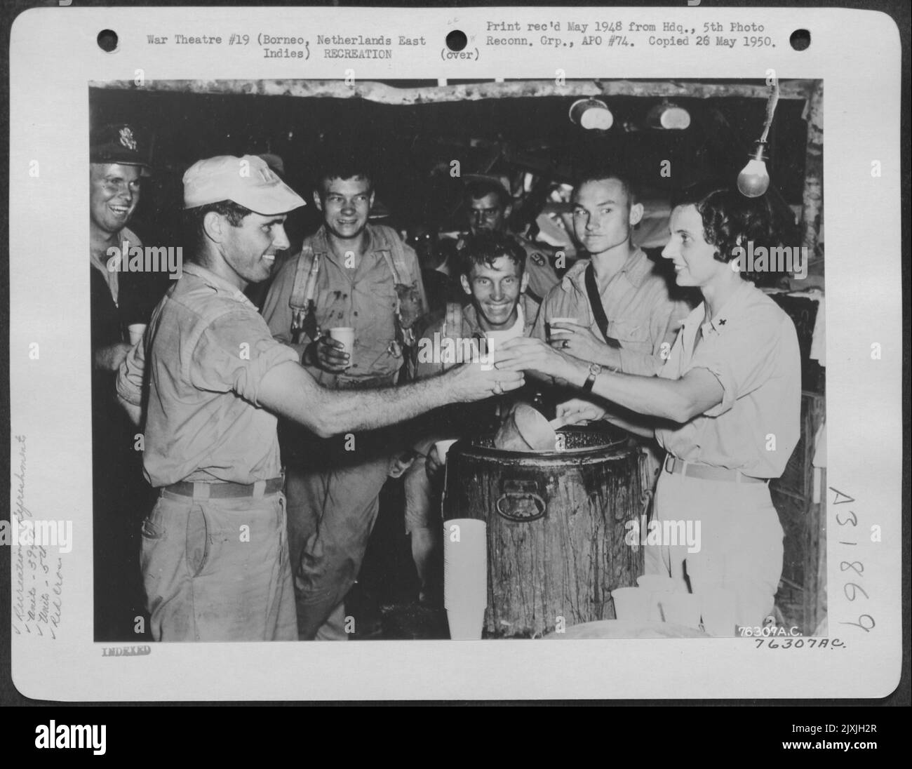 A Red Cross worker serves refreshments to members of the 394th Bomb ...