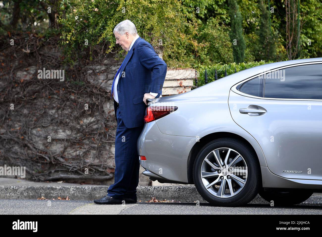Former Seven Network CEO David Leckie leans on a car as he arrives at ...