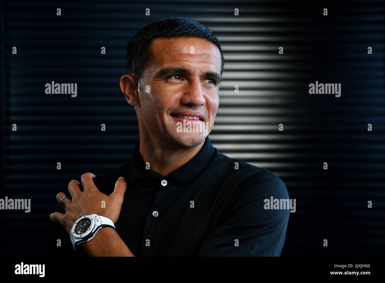 Socceroos player Tim Cahill poses for a photo after announcing his ...