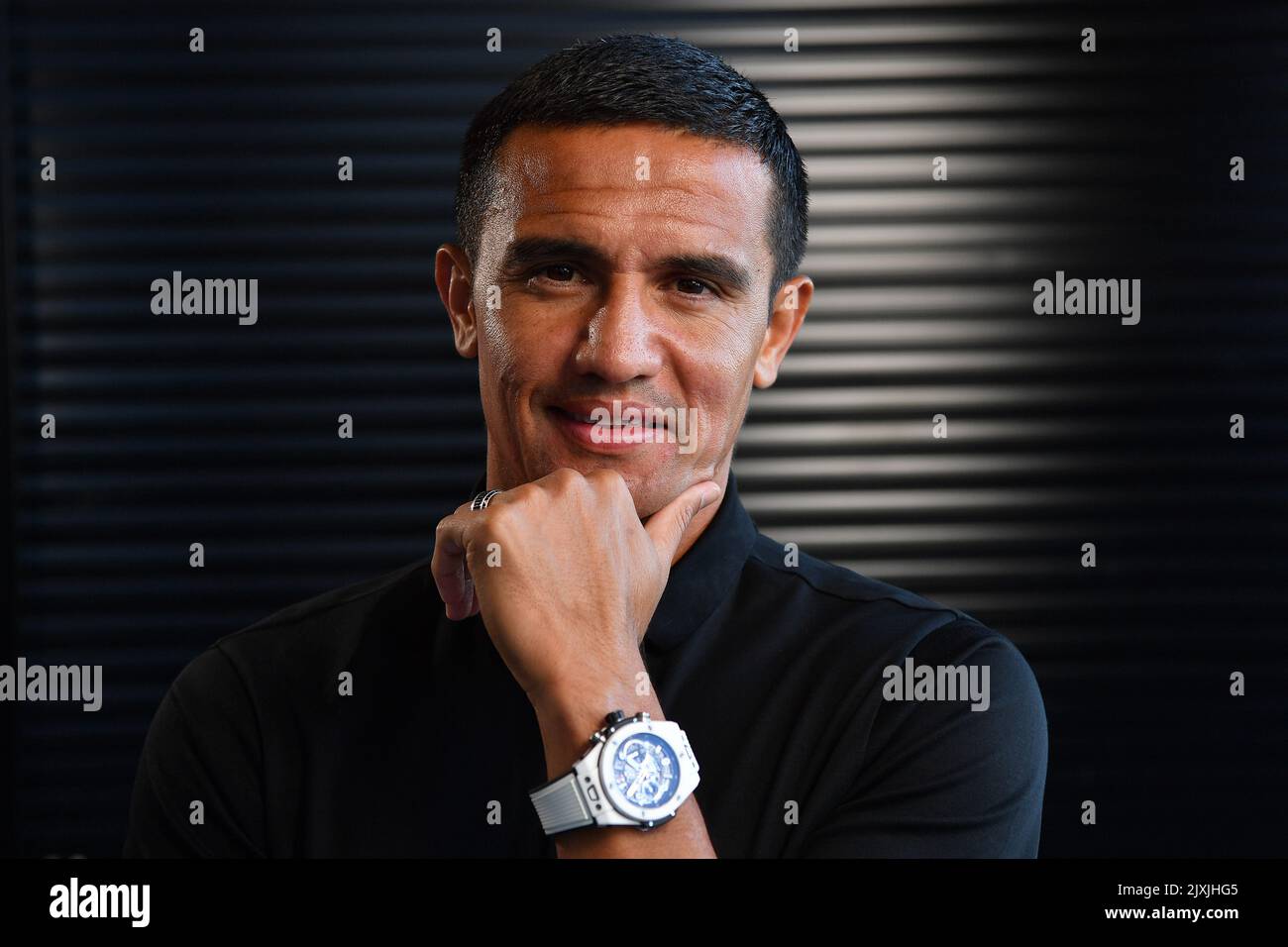 Socceroos player Tim Cahill poses for a photo after announcing his ...