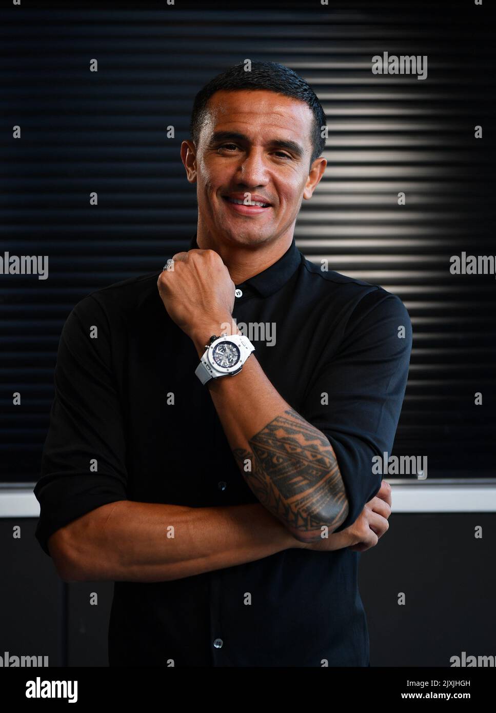 Socceroos player Tim Cahill poses for a photo after announcing his ...