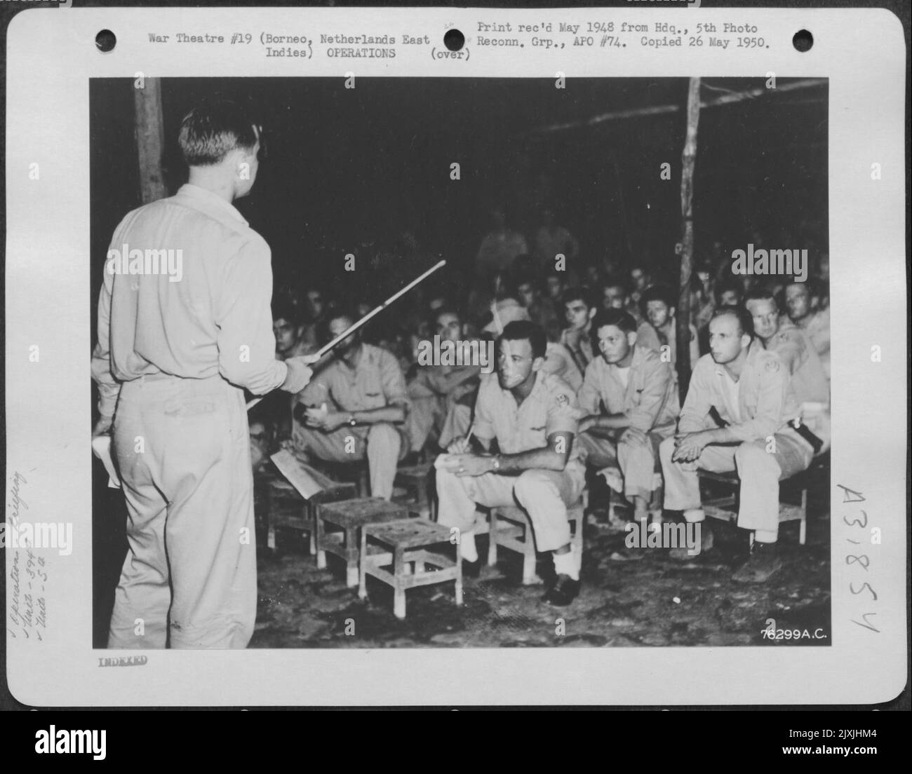The Group Operations Officer briefing men of the 394th Bomb Squadron ...