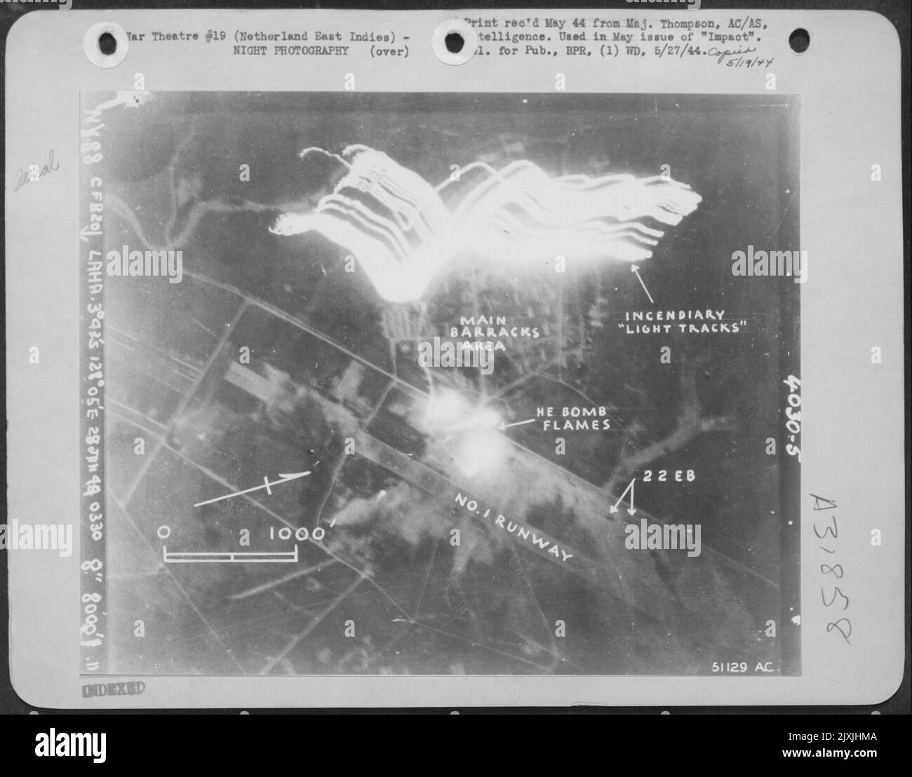 Incendiaries streak film and HE bursts register (center) at Laha Field ...