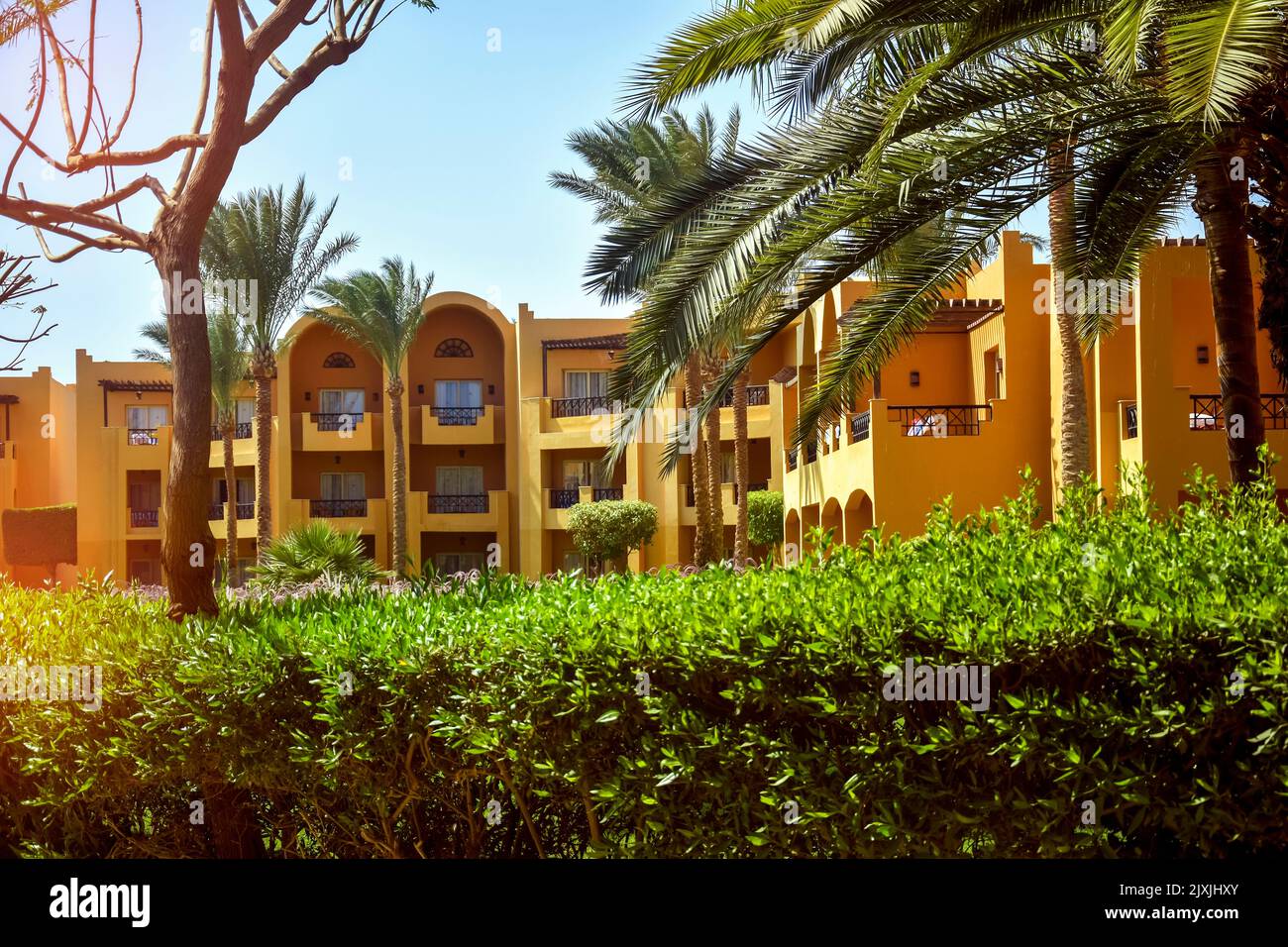 Architecture of buildings is in Arabic style. An arch windows in wall ...