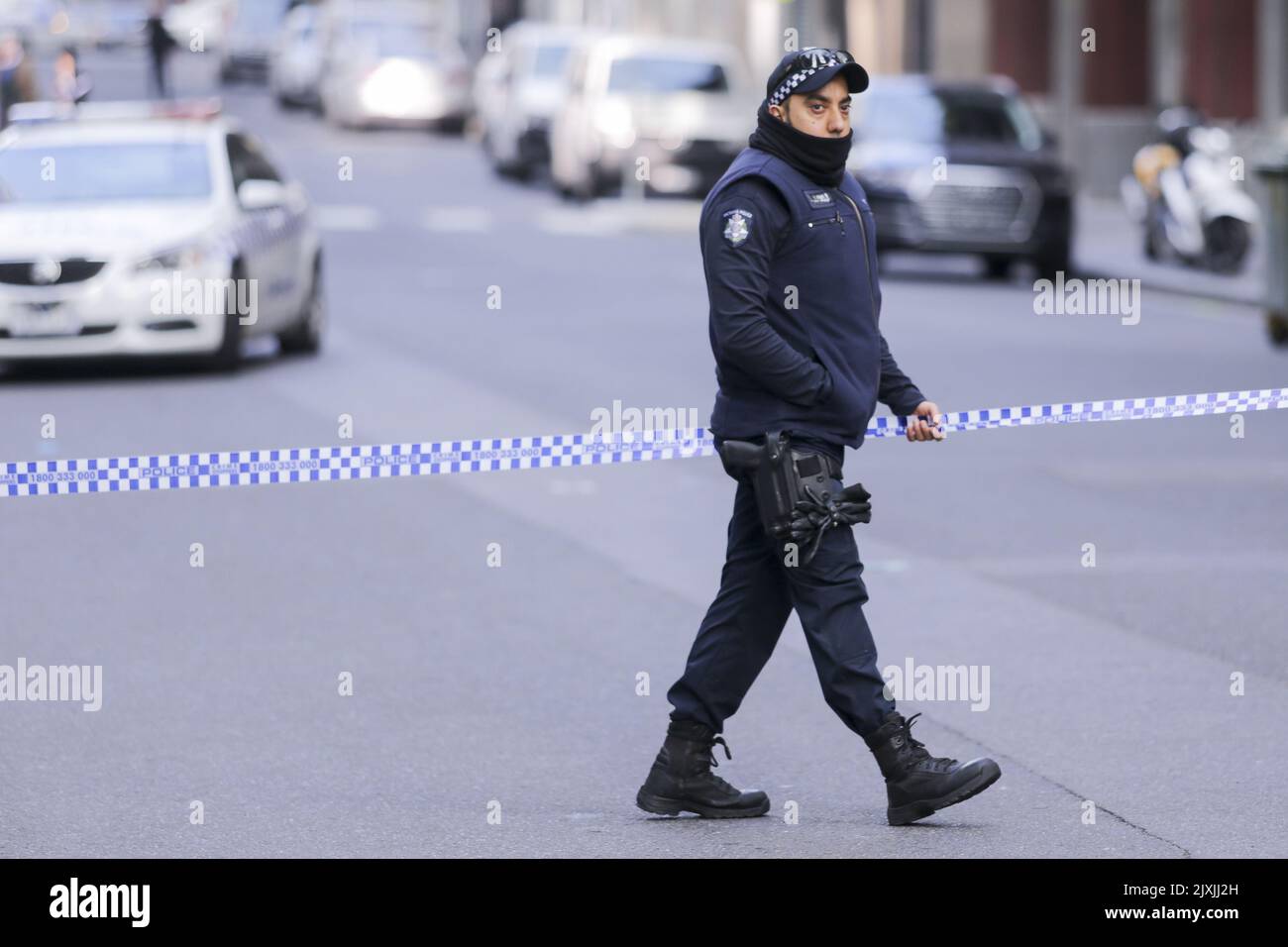 Police investigate a crime scene at the EQ Arcade building on A'Beckett ...