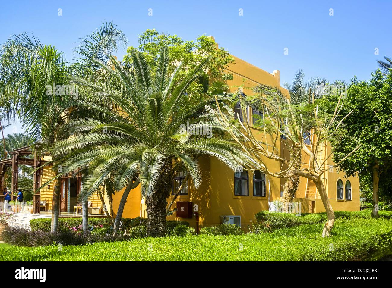 Architecture of buildings is in Arabic style. An arch windows in wall ...
