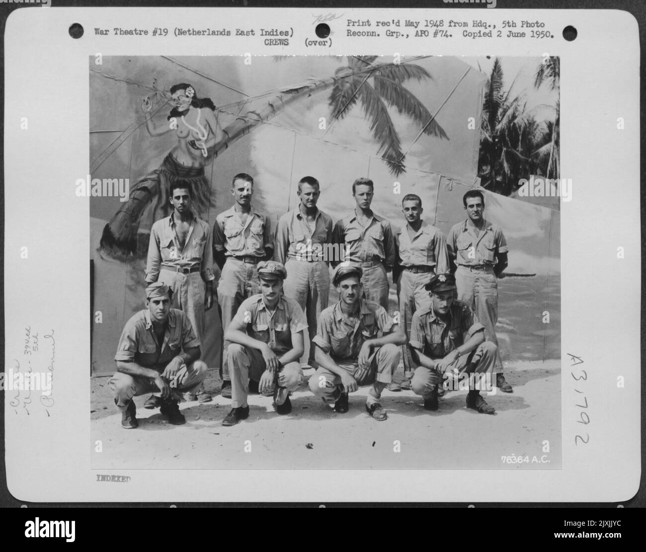 Lt. Whitaker and crew of the 394th Bomb Group "Bomber Barons," pose for ...